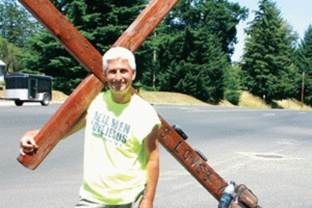 Evangelist bears cross on road through Sweet Home - The New Era