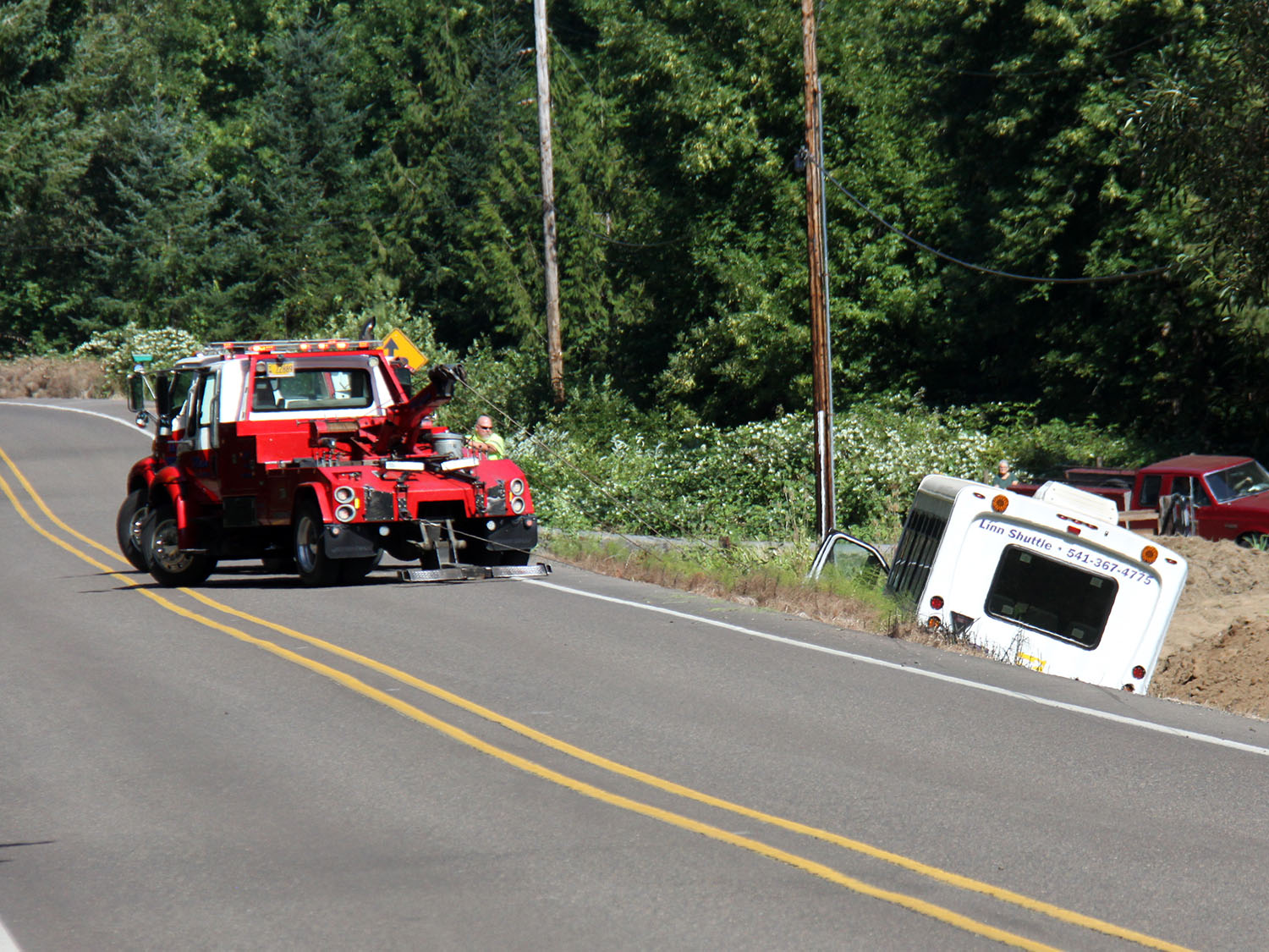 Linn Shuttle bus removed from ditch on North River - The New Era